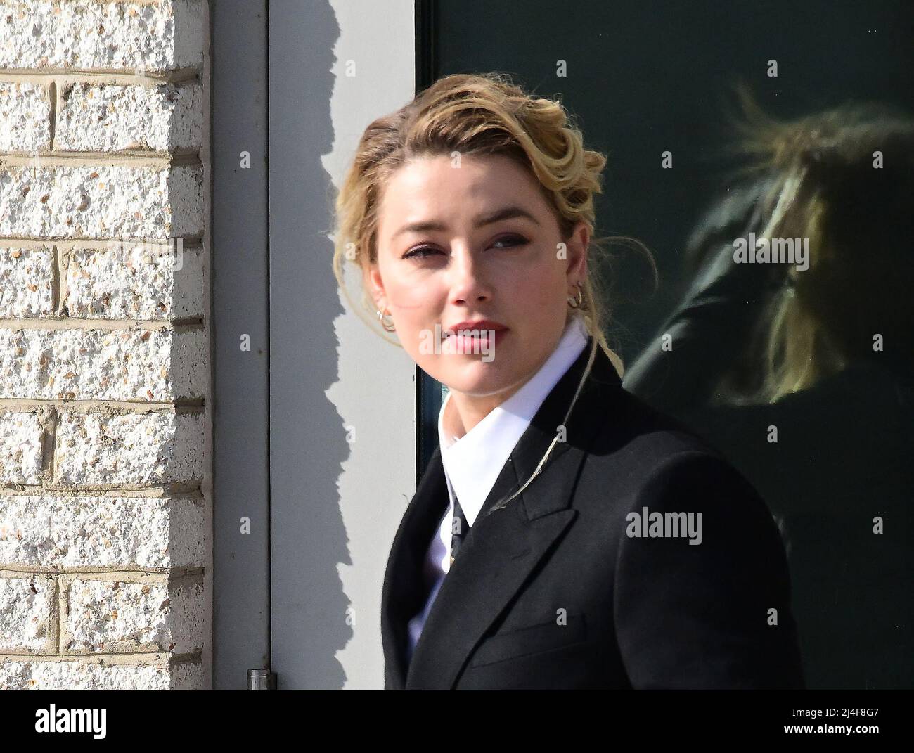 Amber Heard departs after her trial recessed for the day at the Fairfax ...