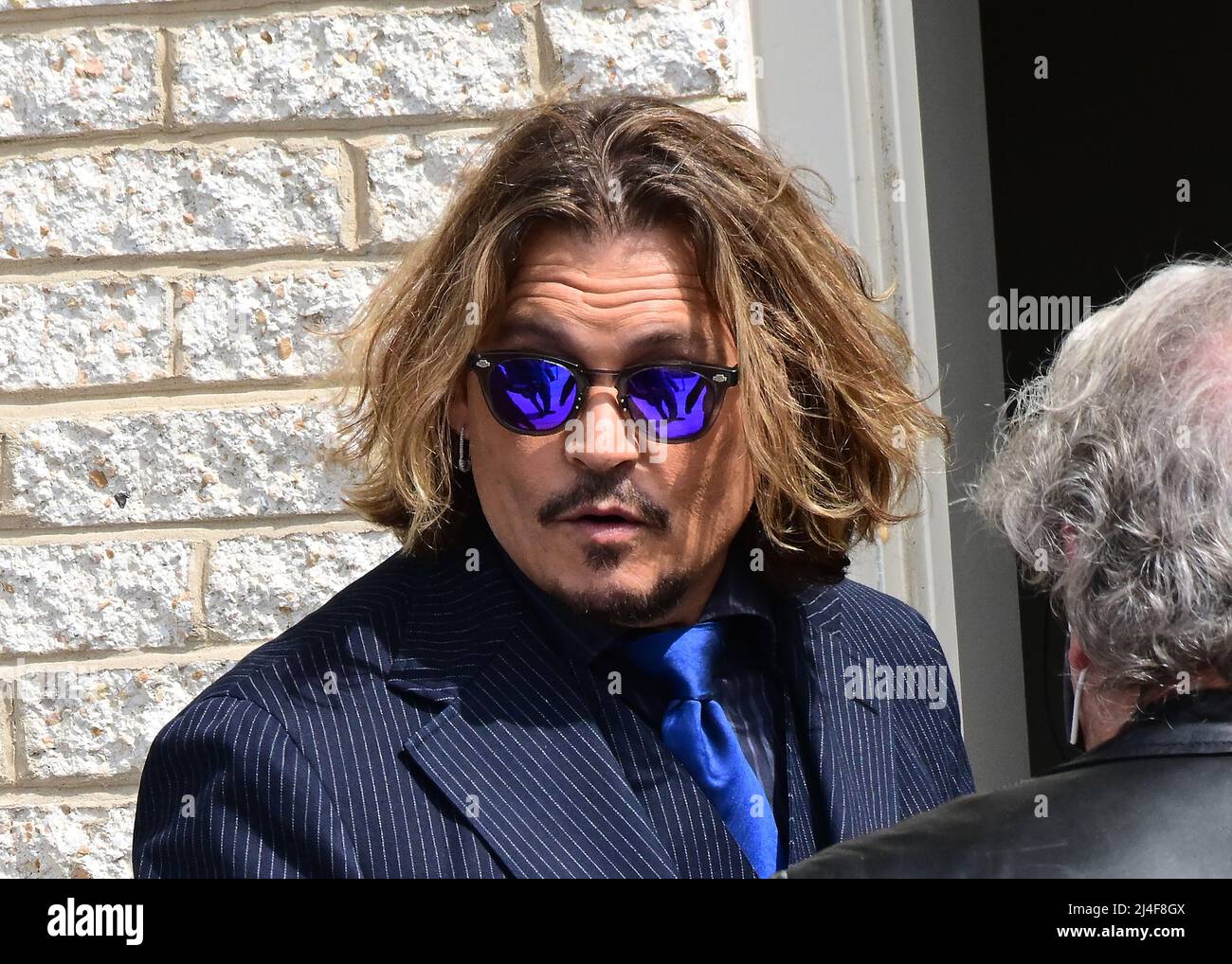 Johnny Depp goes outside during a break in his trial at the Fairfax ...