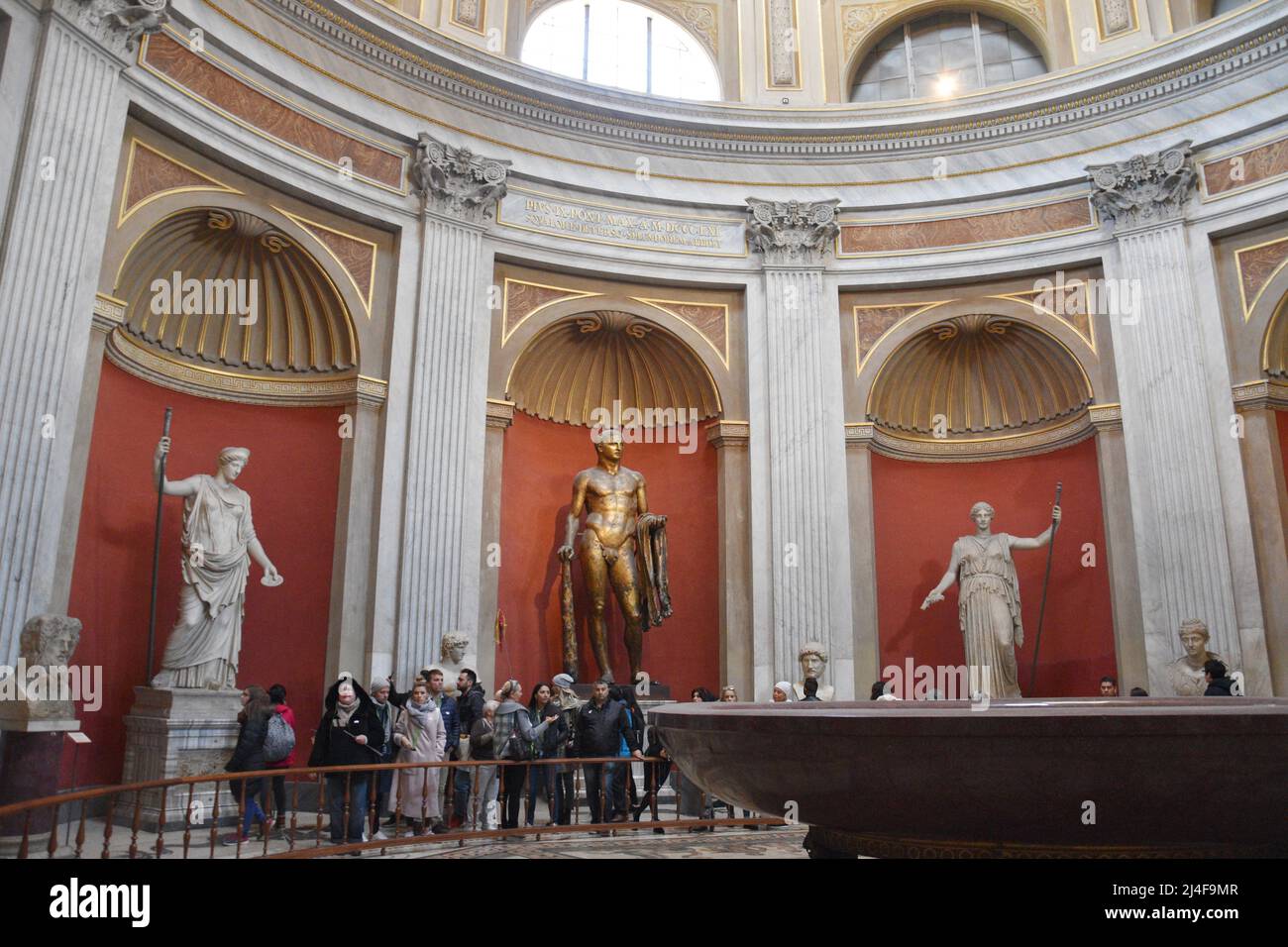 Tourists viewing the ancient statues in the Sala Rotonda of the Vatican ...
