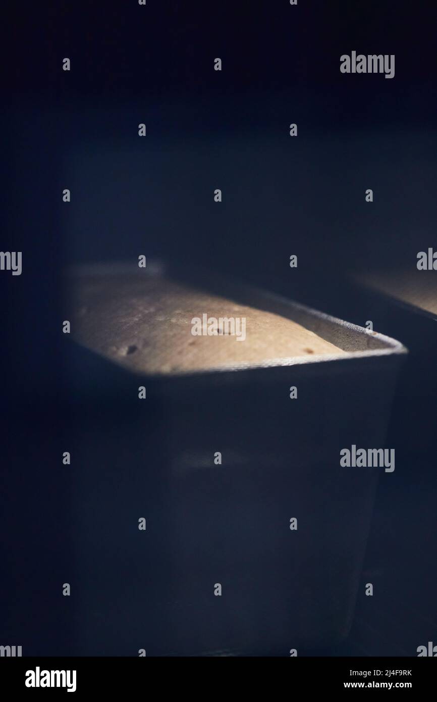 The process of making molded rye bread. Baking bread in the oven. Photo ...