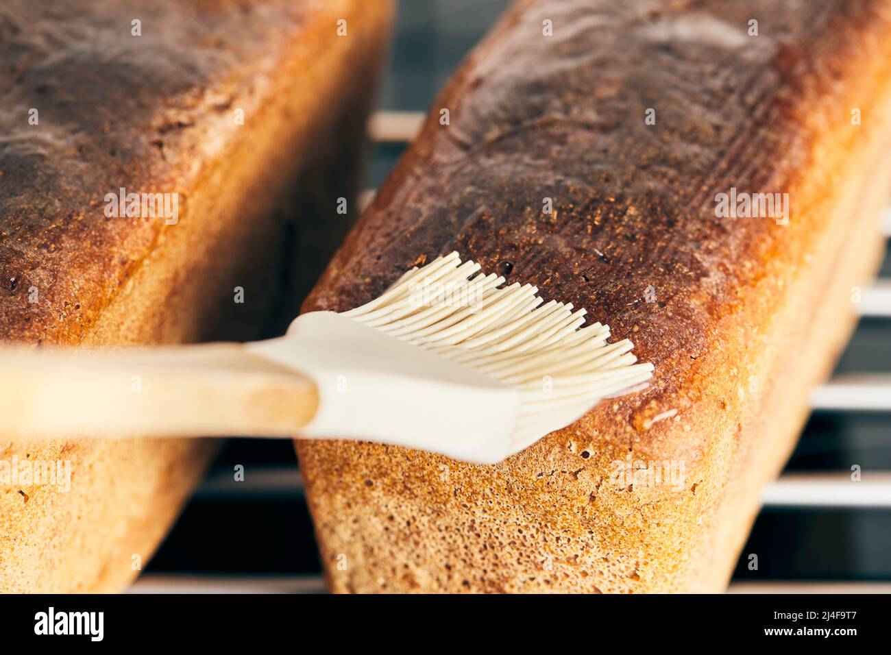 The process of making rye molded bread. Coating the finished bread with ...