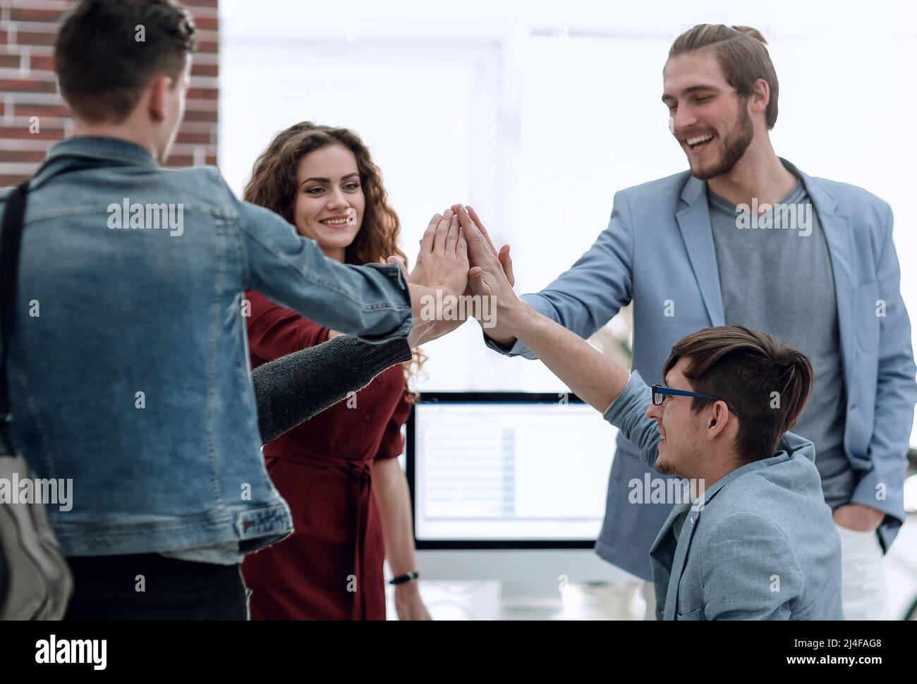 Business people happy showing team work and giving five Stock Photo - Alamy