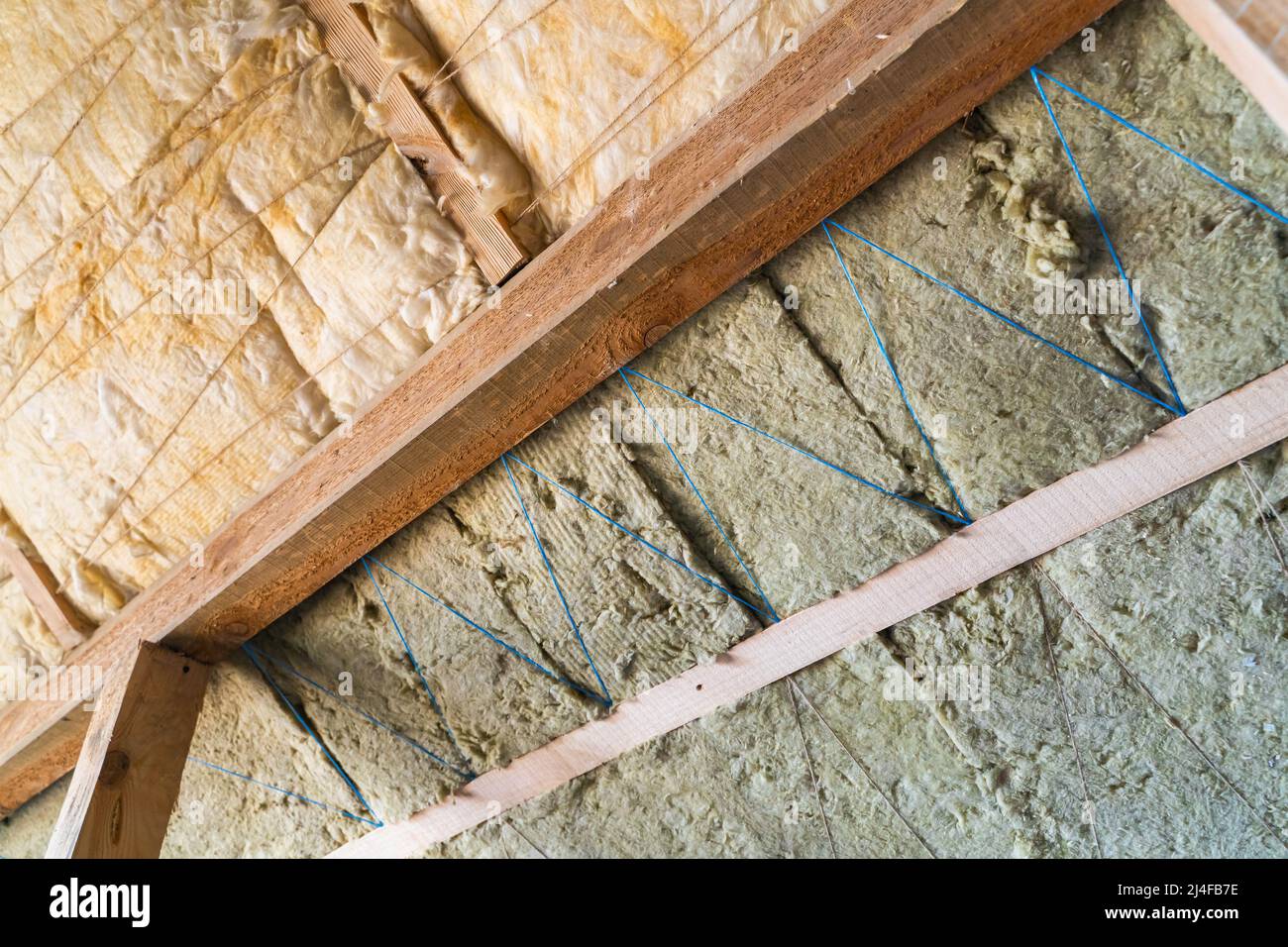 Comparison of mineral and glass wool in one frame. Roof insulation ...