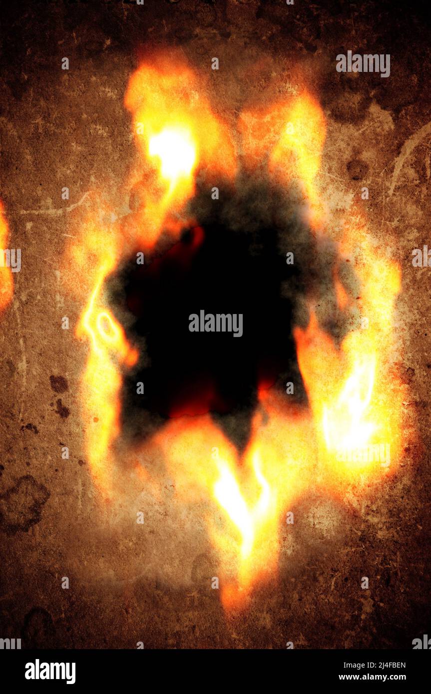 old brown paper burning with a hole in the middle Stock Photo - Alamy