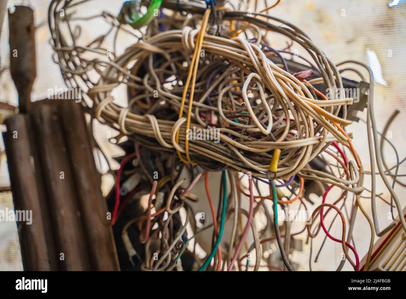 Coiled old wiring from old colored wires close-up. Precious metals in ...