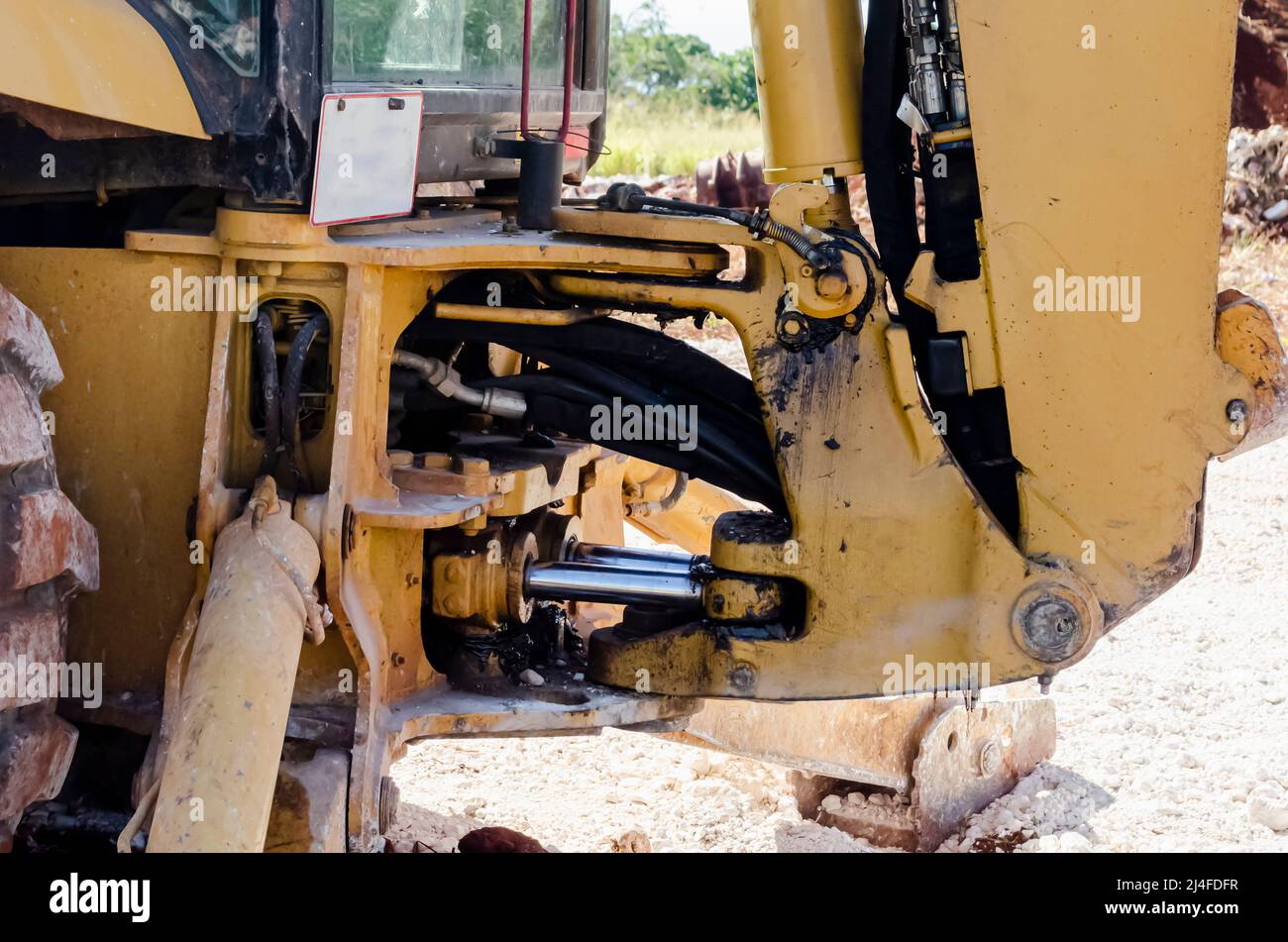 The swing frame of the backhoe is connected to the stabilizer arm by ...