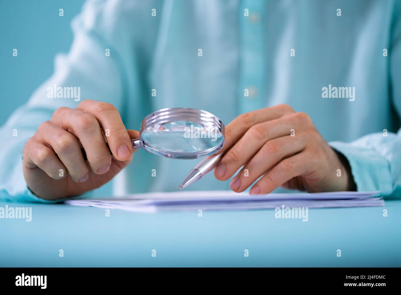 Auditor Using Magnifying Glass For Audit And Fraud Investigation Stock ...