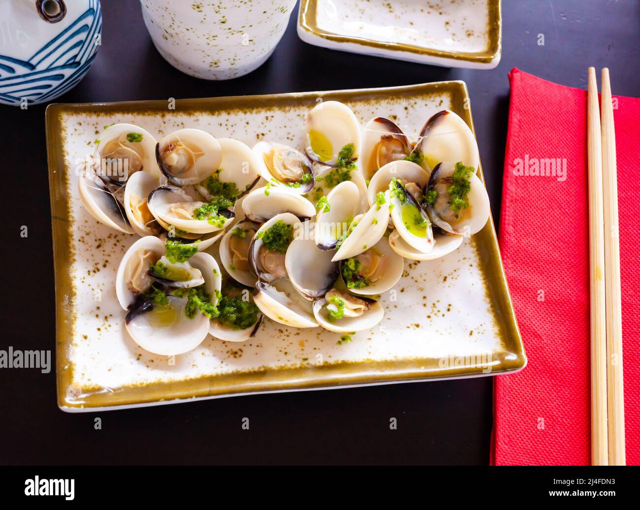 Japanese sake steamed clams with ginger and green onions Stock Photo ...