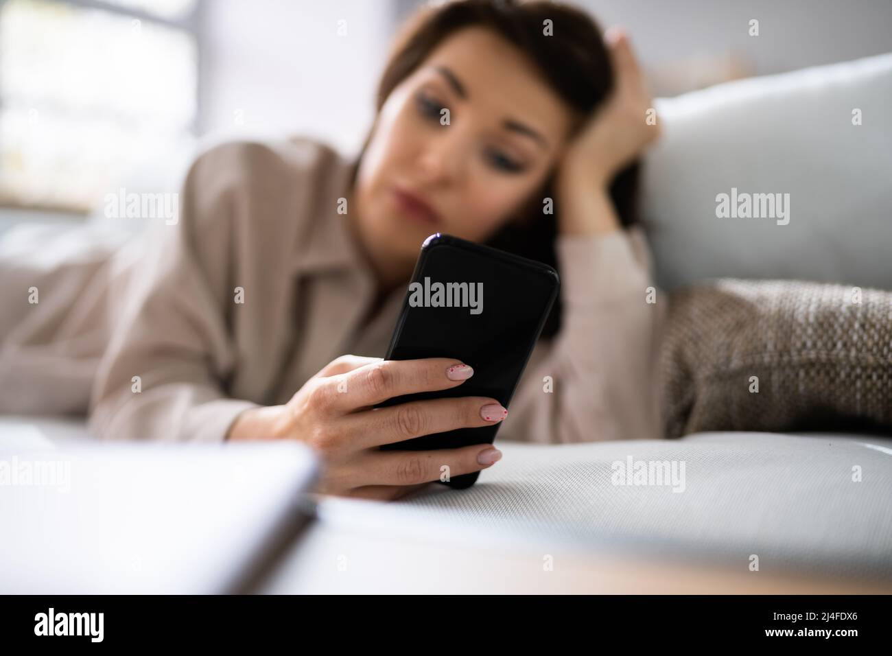 Mobile sad hi-res stock photography and images - Alamy