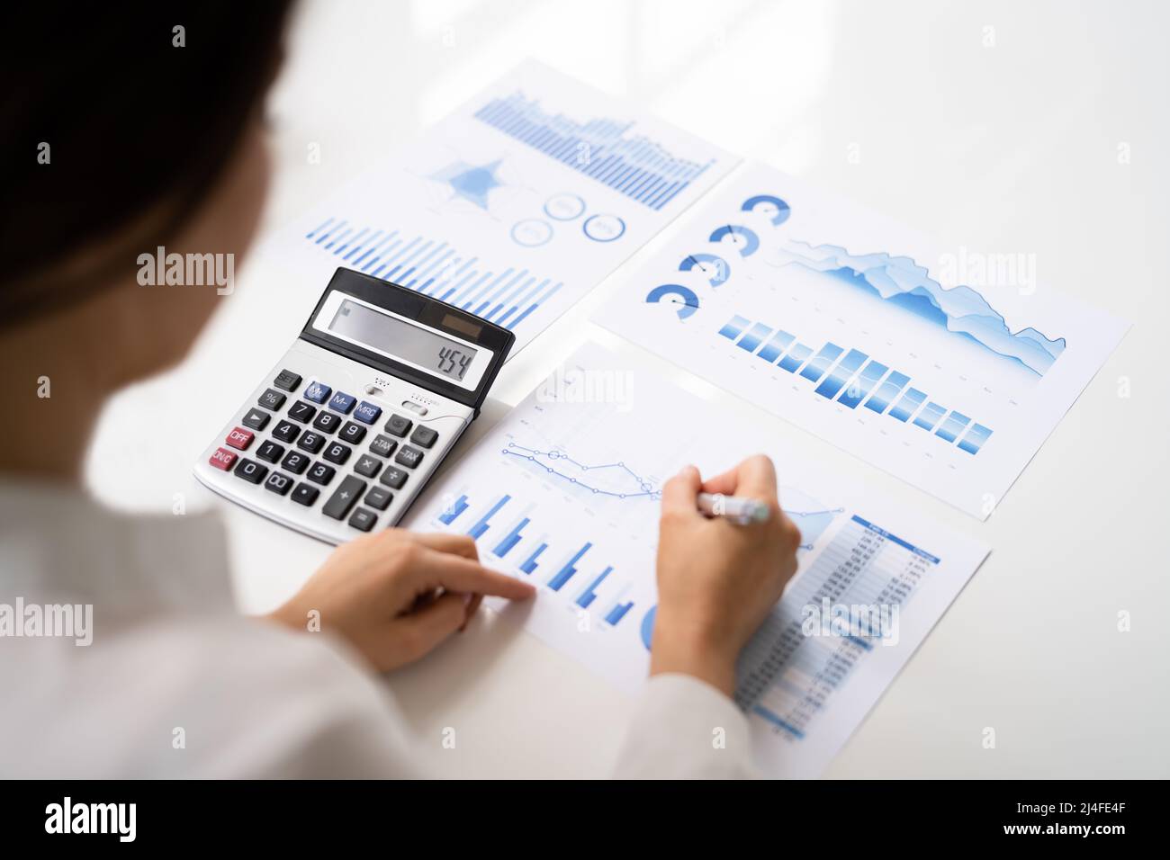 Business Accountant Using Finance Chart Document And Calculator Stock ...