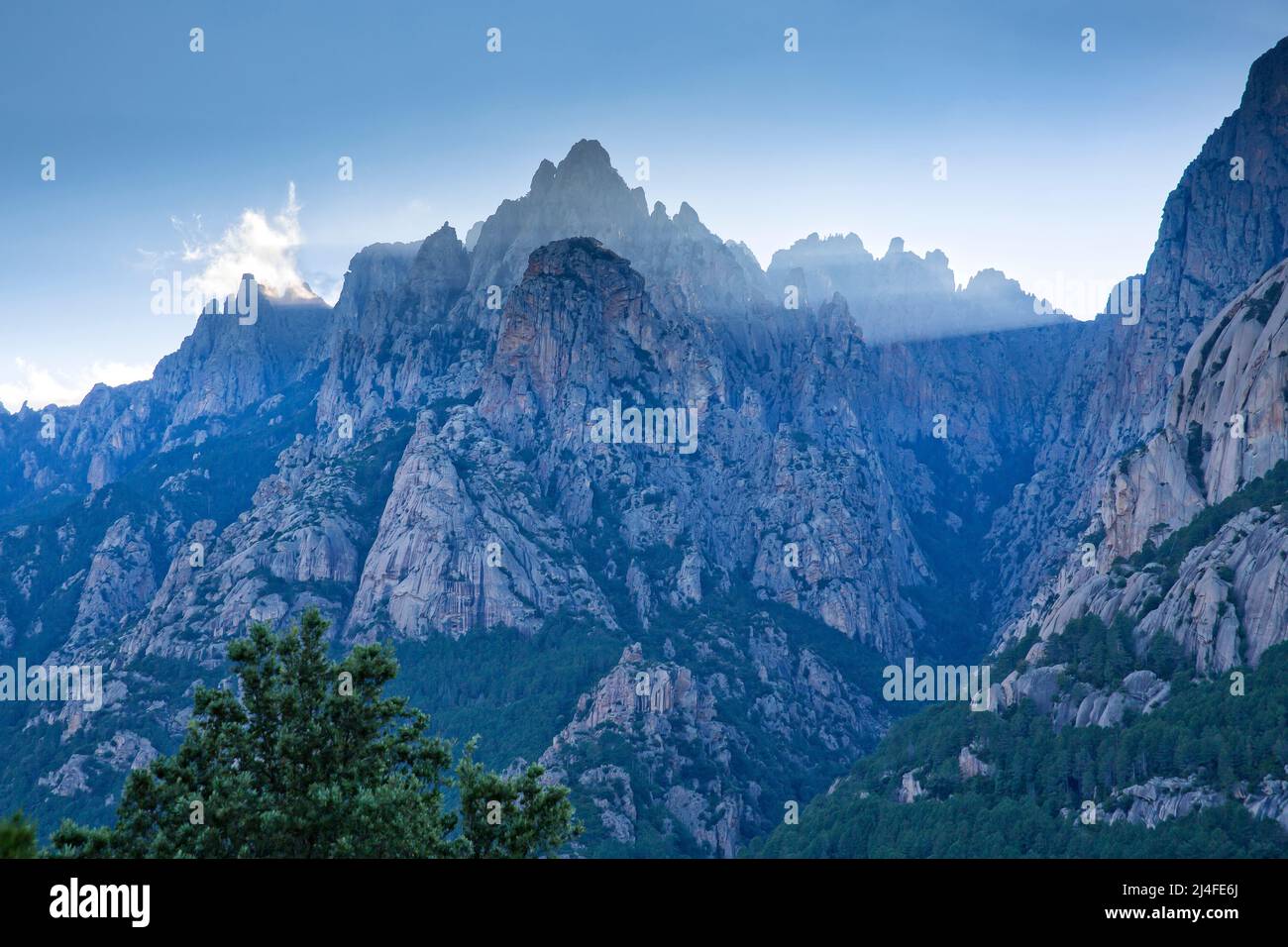 The Aiguilles de Bavella tower into the sky.The Col de Bavella is a ...
