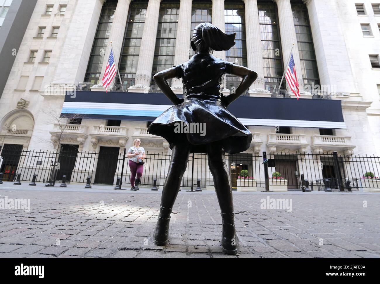 Famous fearless girl statue by Kristen Visbal next to the New York ...
