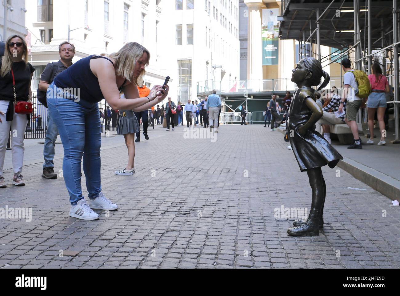 Famous fearless girl statue by Kristen Visbal next to the New York ...