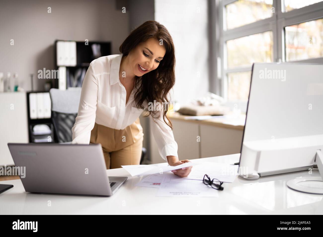 Accountant Woman Using Office Computer To Calculate Invoice Stock Photo ...