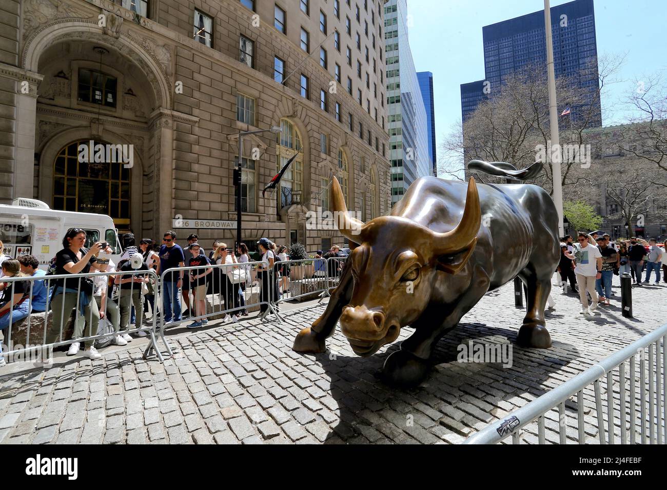 Famous Charging Bull by artist Arturo Di Modica on Broadway in New York Downtown, NY on April 14 ...