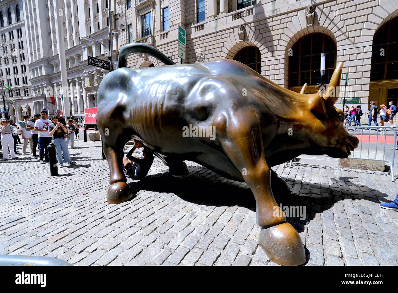 Famous Charging Bull by artist Arturo Di Modica on Broadway in New York Downtown, NY on April 14 ...