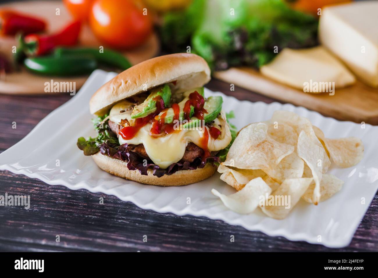 mexican burger with chips and avocado on table food with ingredients in ...