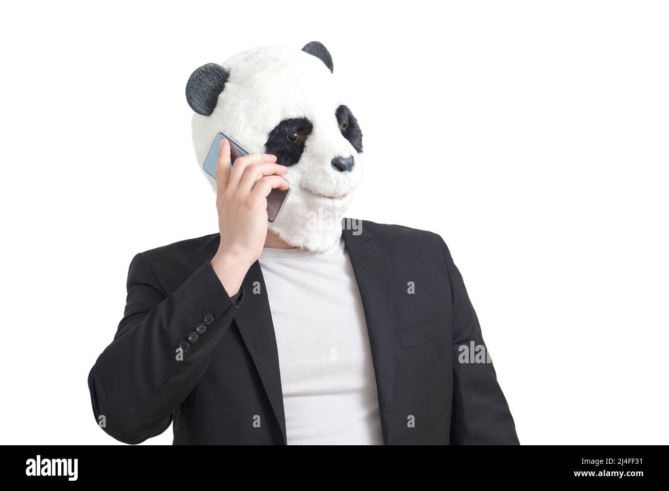 Man wearing a panda mask head and a suit speaking on the smartphone ...