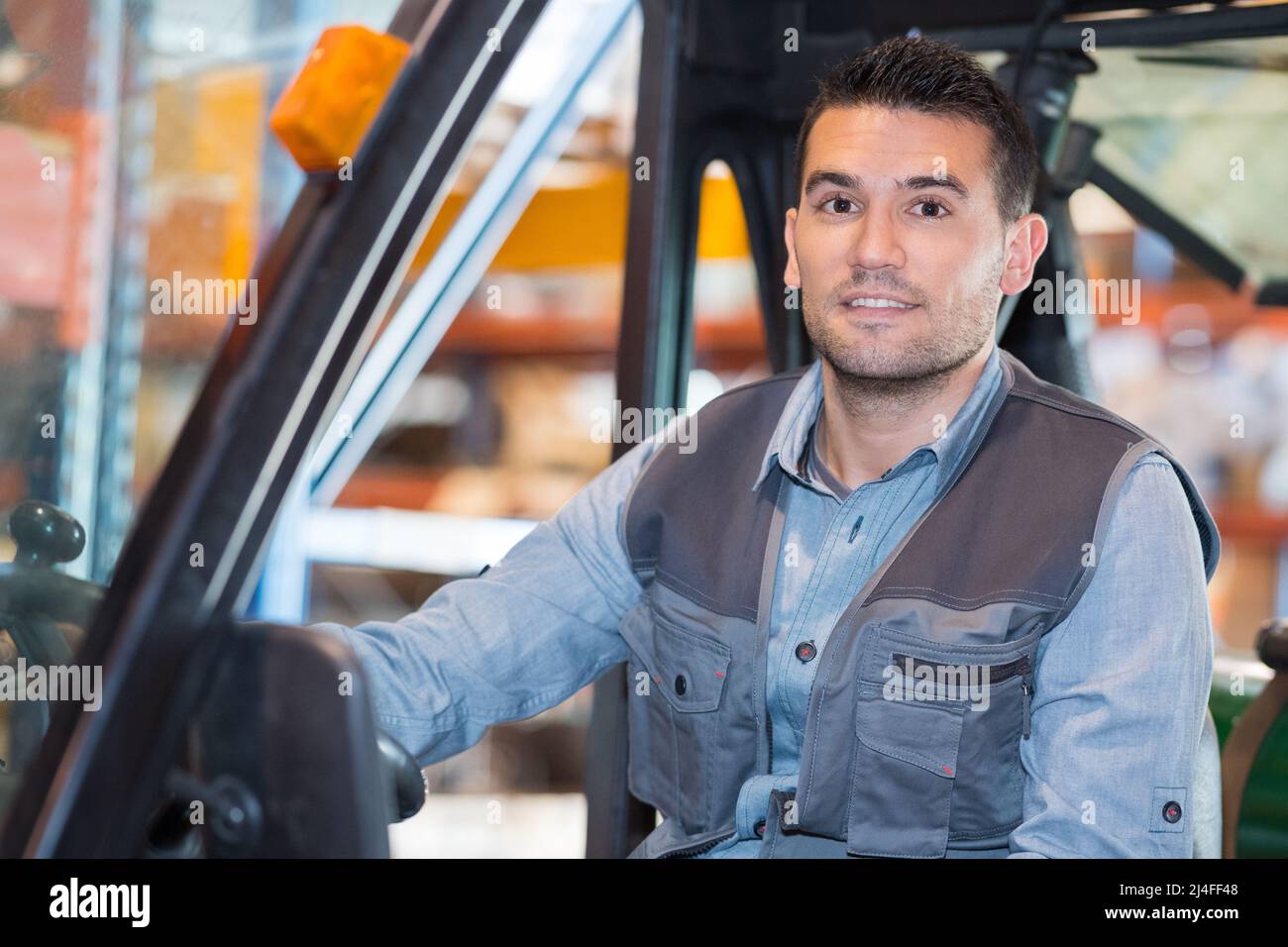 portrait of forklift operator posing Stock Photo - Alamy