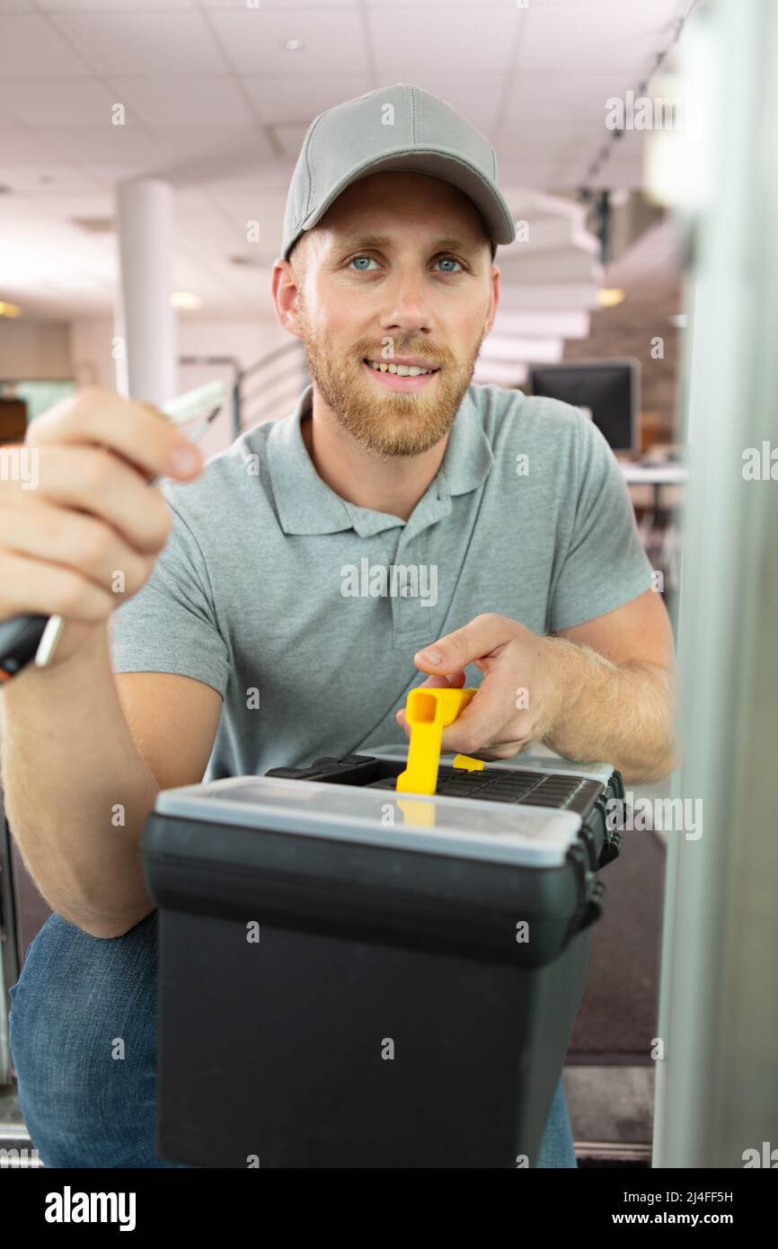 Close up construction worker carrying tool box hi-res stock photography ...