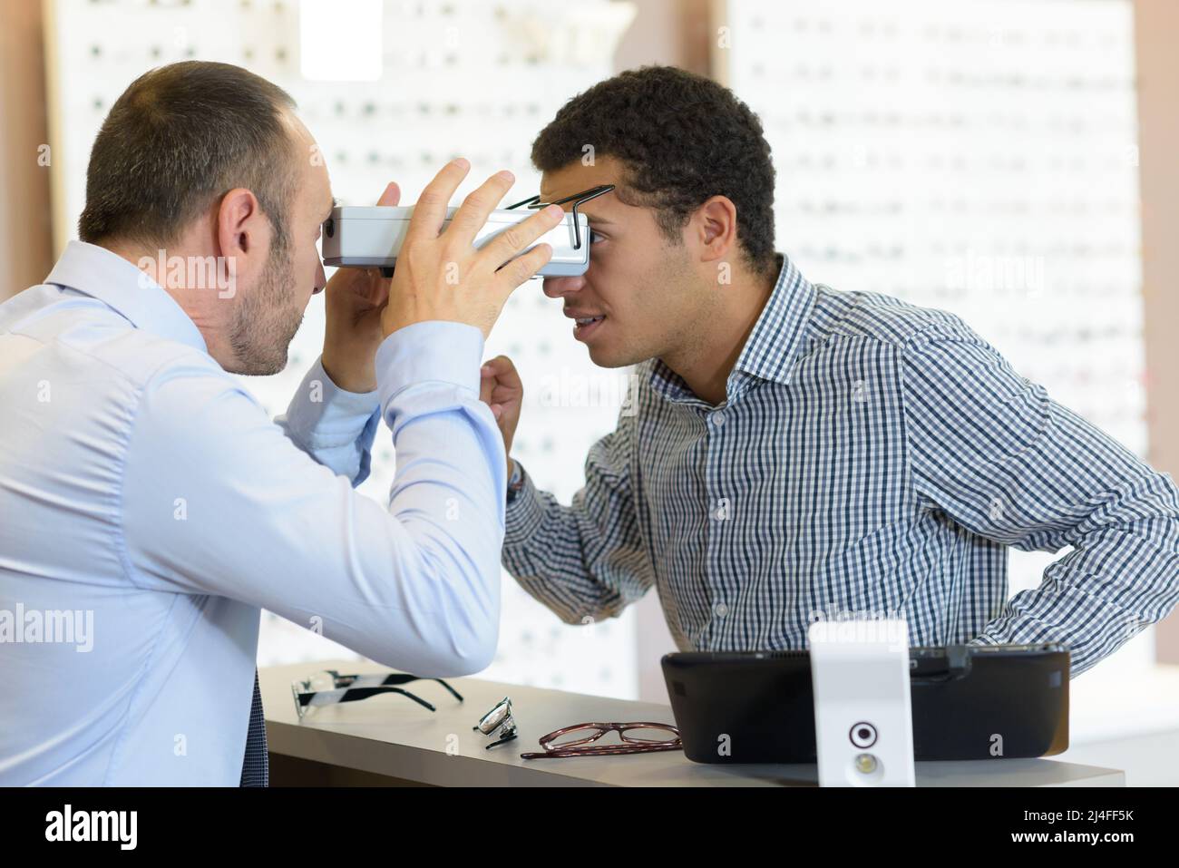 boy having her eyes tested Stock Photo - Alamy