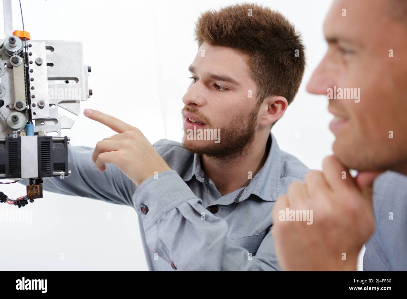 robotics engineer inspecting a machine Stock Photo - Alamy