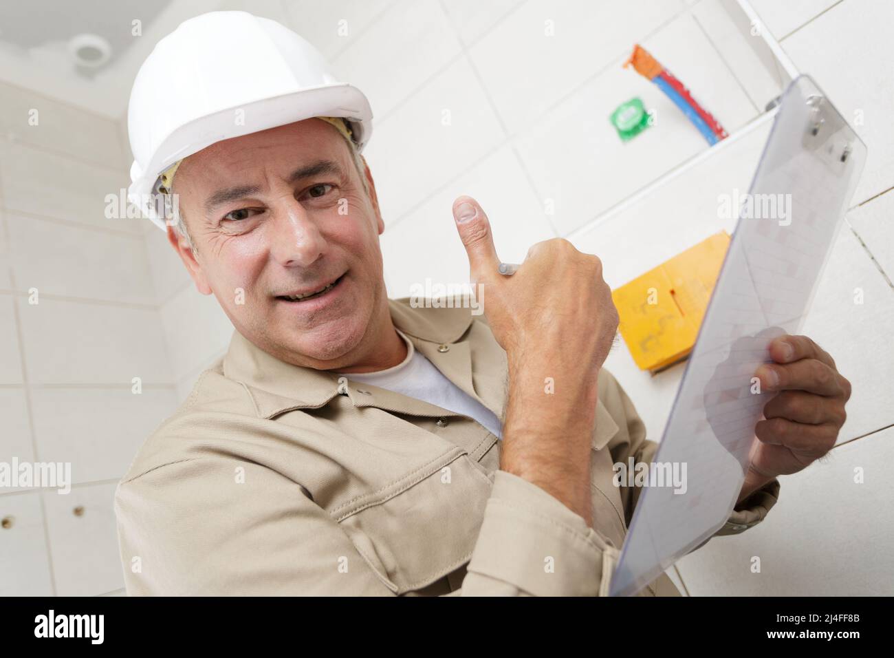 portrait of happy plumber in site Stock Photo - Alamy