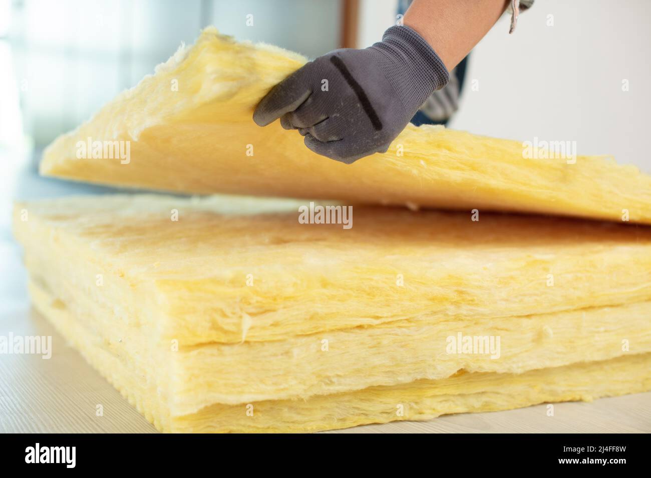 hand holding an insulation sheet Stock Photo - Alamy
