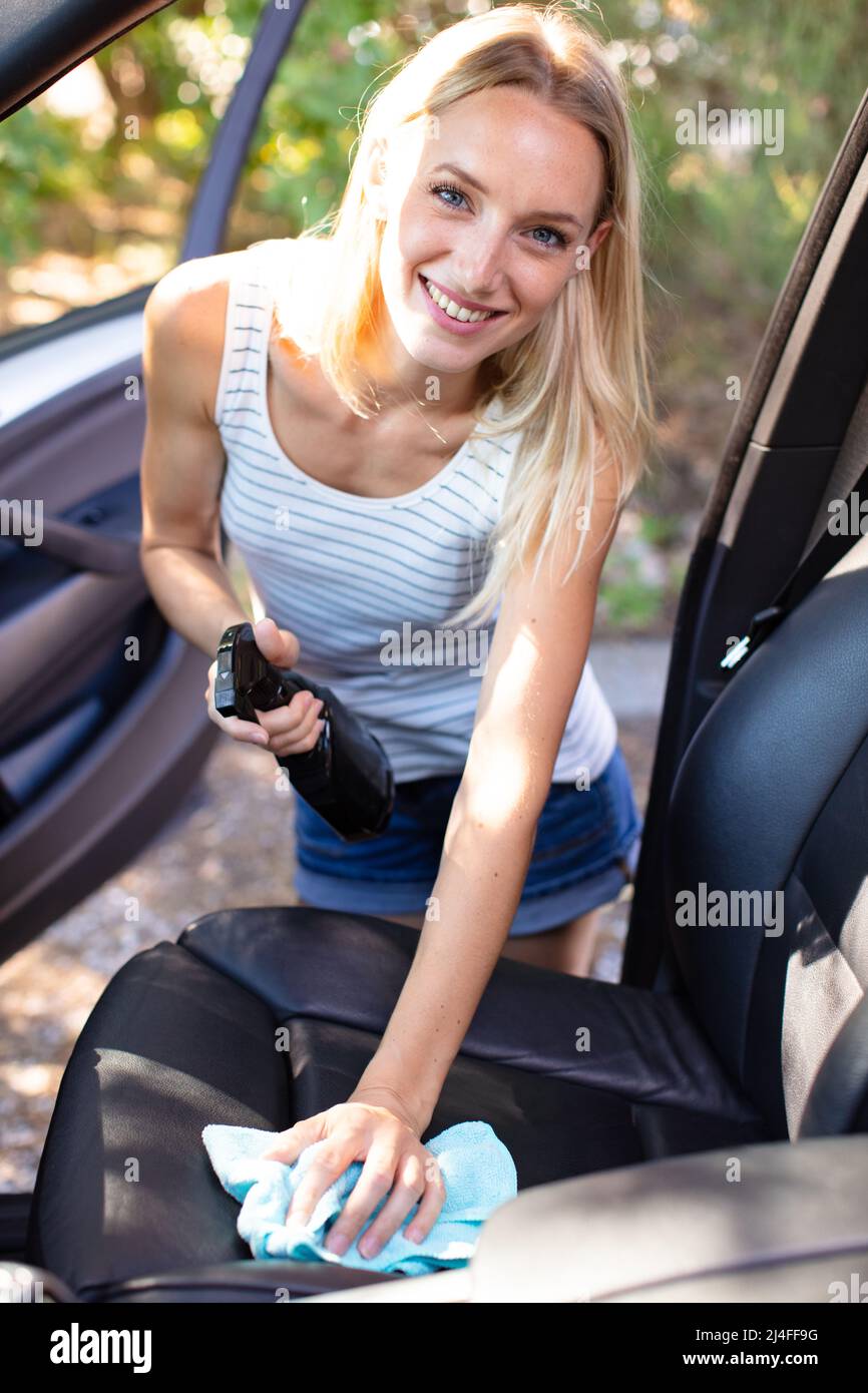 beautiful woman cleaning her car Stock Photo - Alamy
