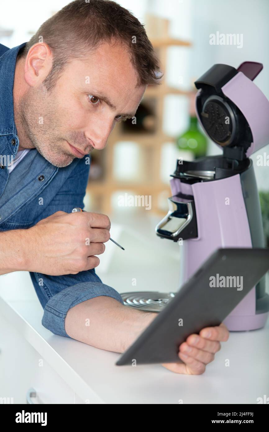 Male repairman coffee machine hi-res stock photography and images - Alamy
