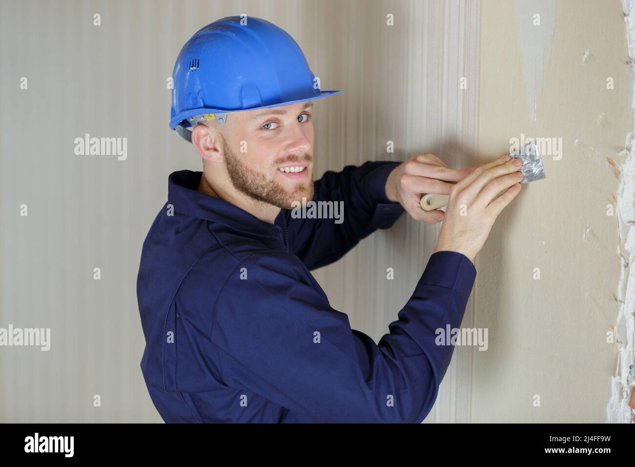 professional builder plastering wall with plastering float Stock Photo ...