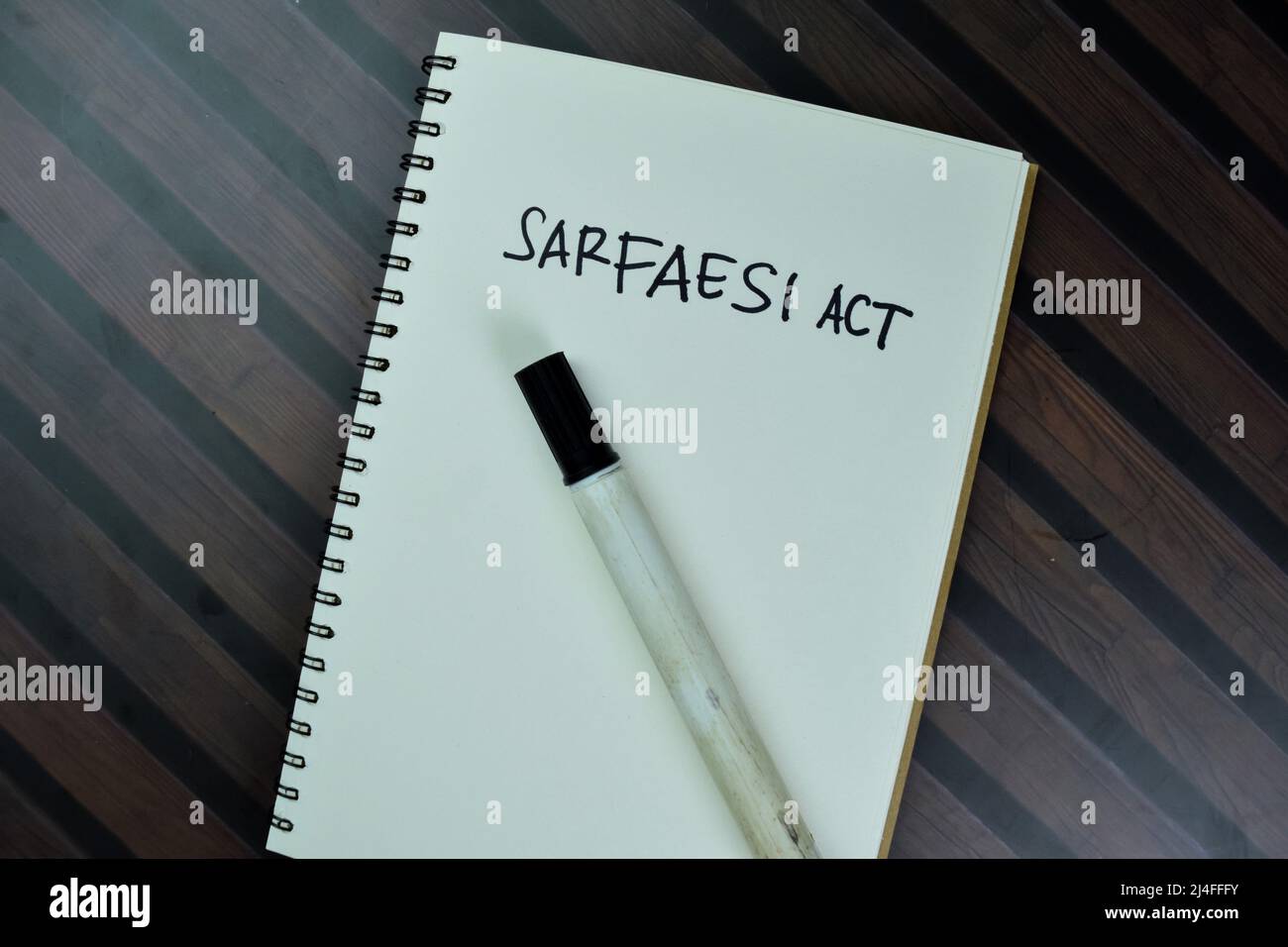 The Book of Sarfaesi Act isolated on Wooden Table Stock Photo - Alamy