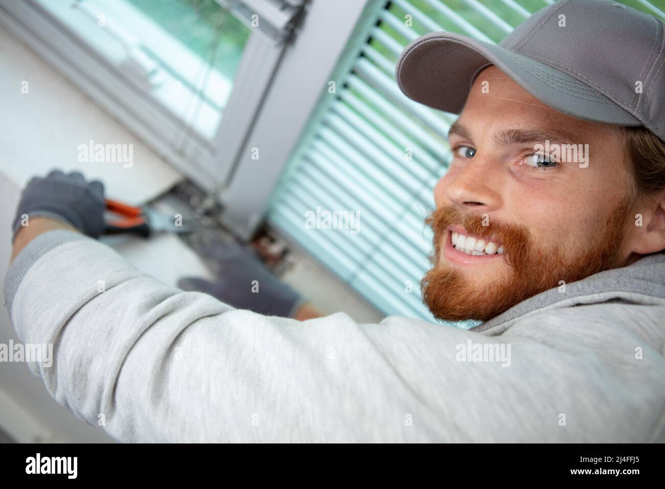 Young contractor installing window hi-res stock photography and images ...