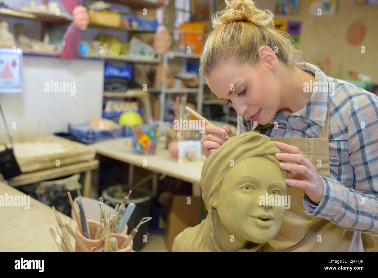 female clay sculpture at work Stock Photo - Alamy