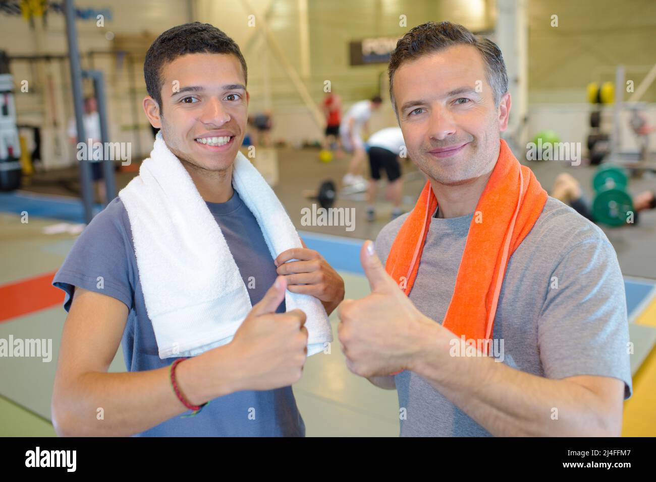 coach and man in boxing class with thumbs up Stock Photo - Alamy