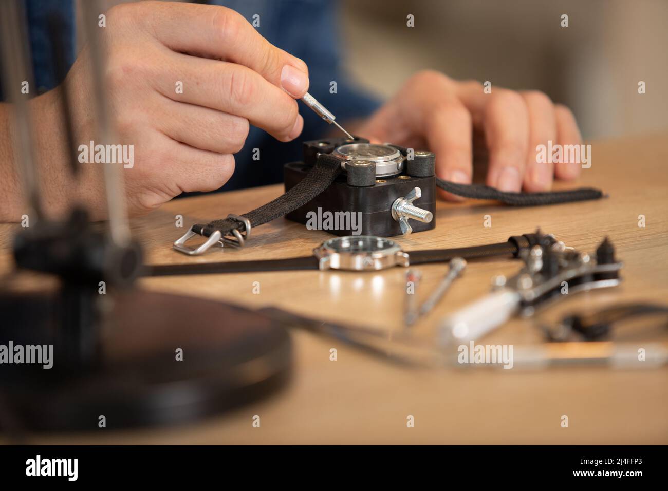 hands crafting and fix the watch machine Stock Photo - Alamy