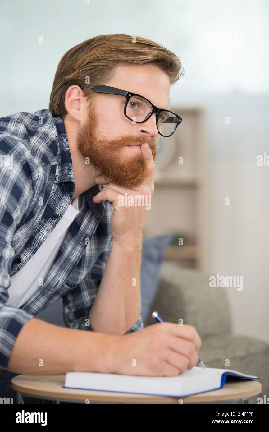 Beard young man thinking writing hi-res stock photography and images ...