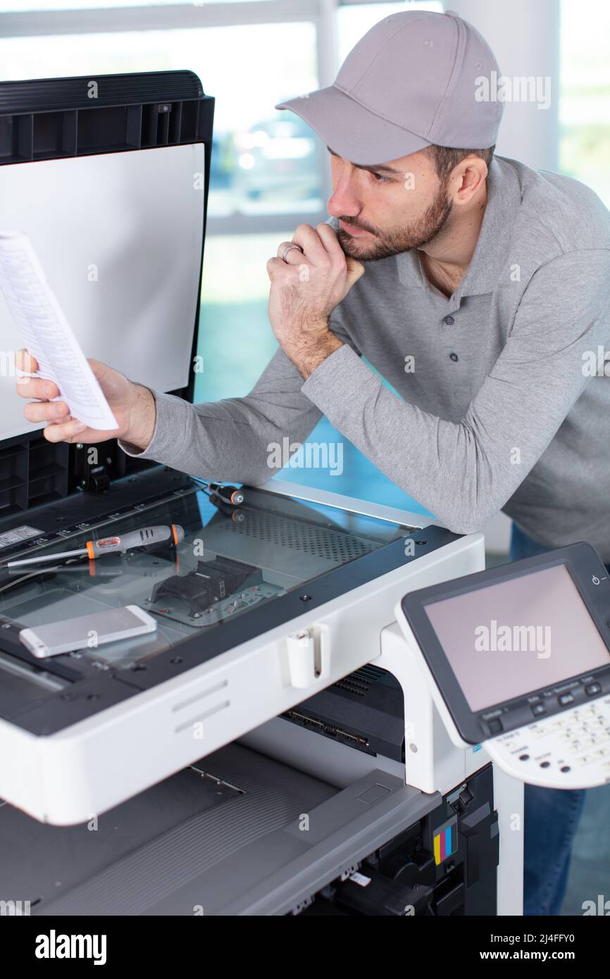 Man Repairing Photocopier High Resolution Stock Photography and Images ...