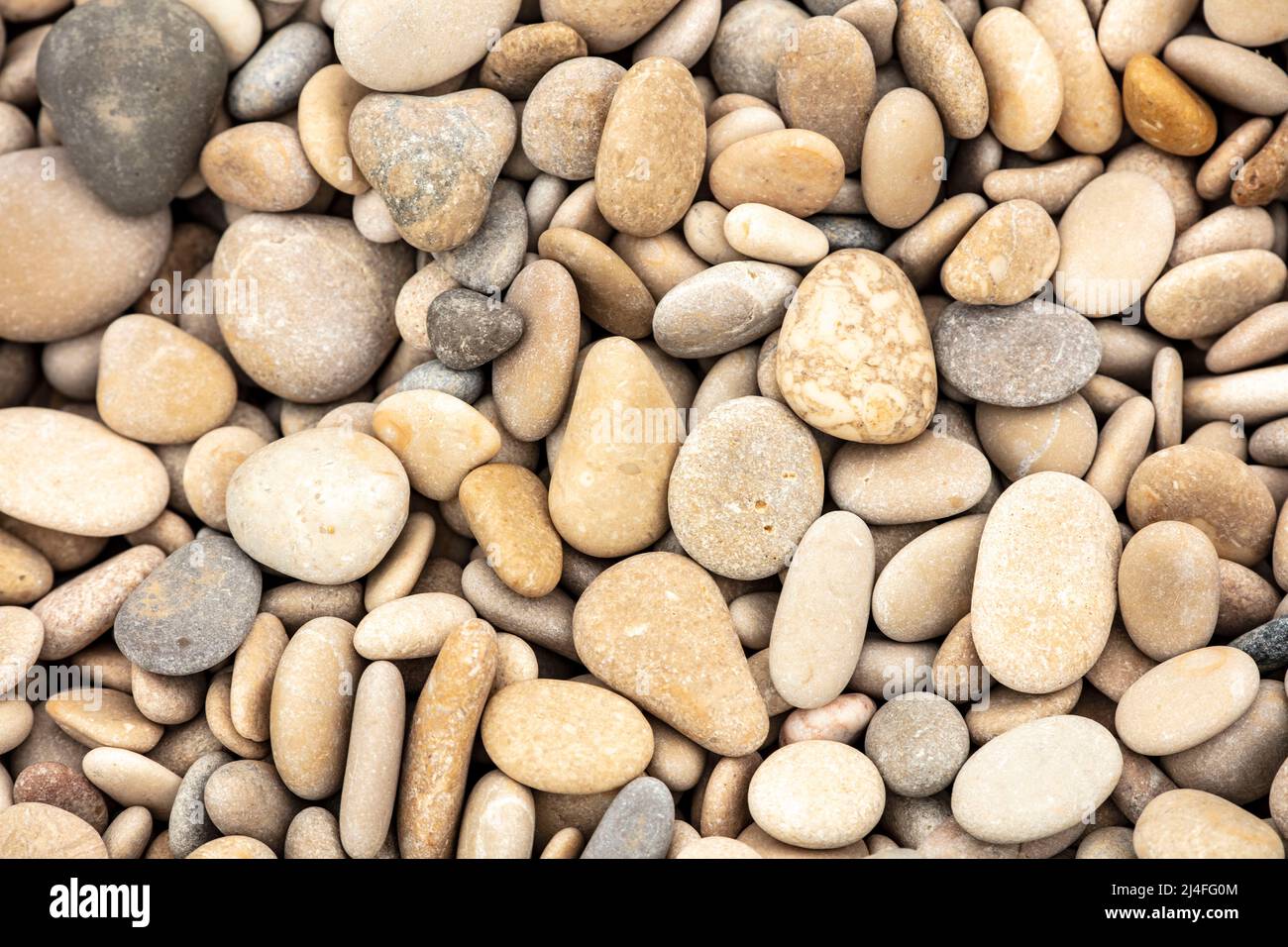 Random patterns in nature, small beach pebbles on the Costa Blanca ...