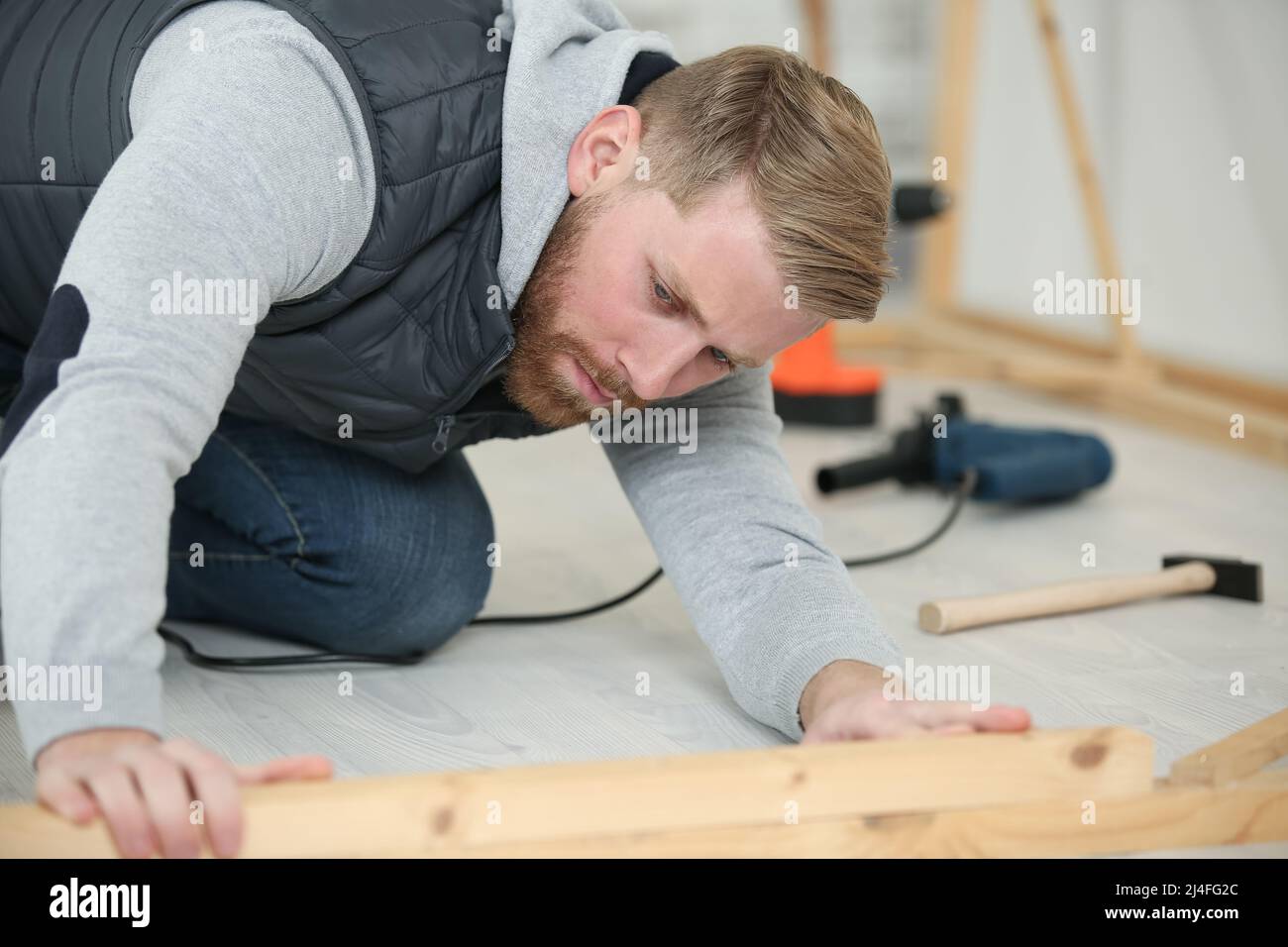 man working on structure of the wood Stock Photo - Alamy