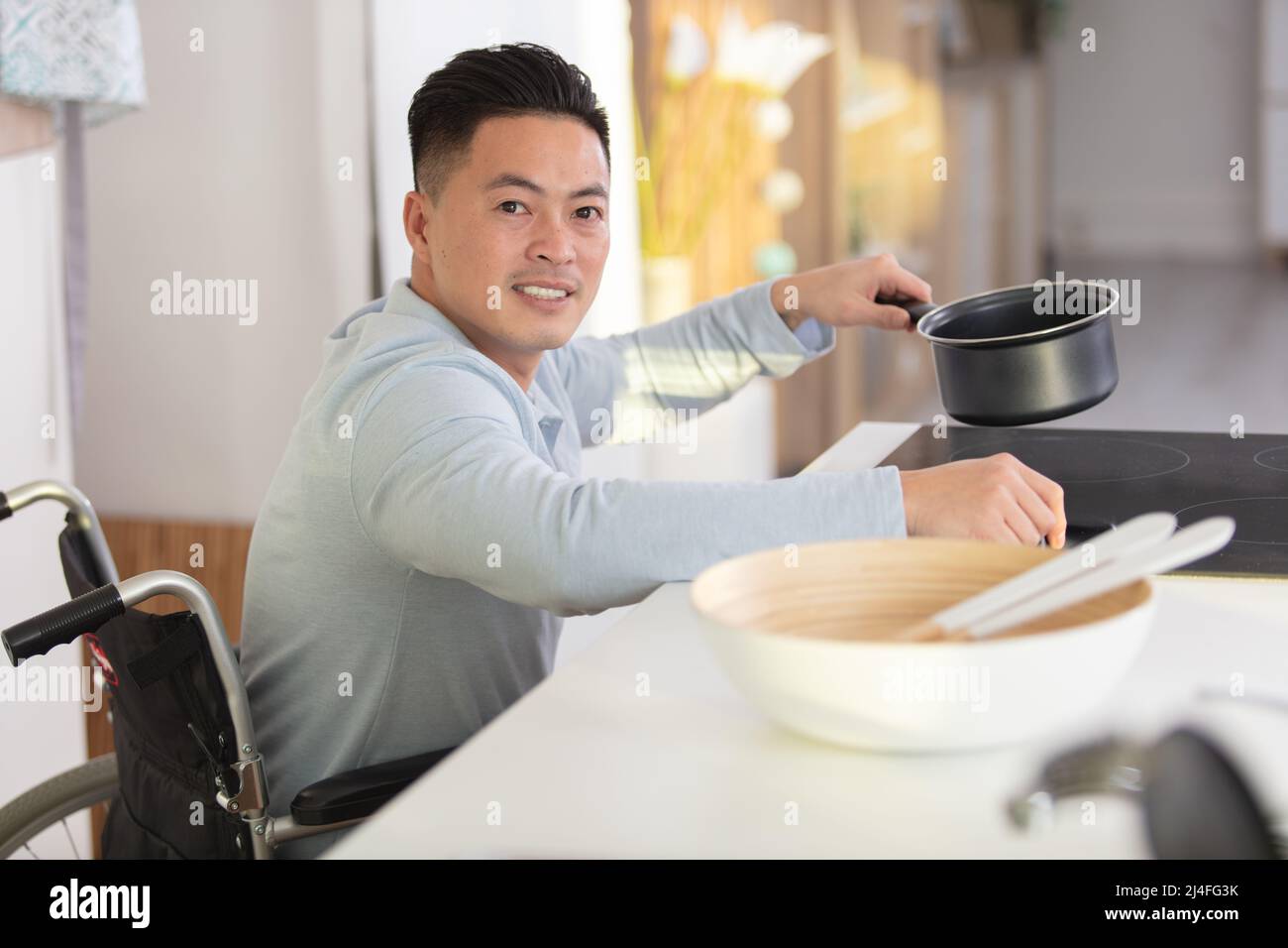 Person with disability cooking hi-res stock photography and images - Alamy