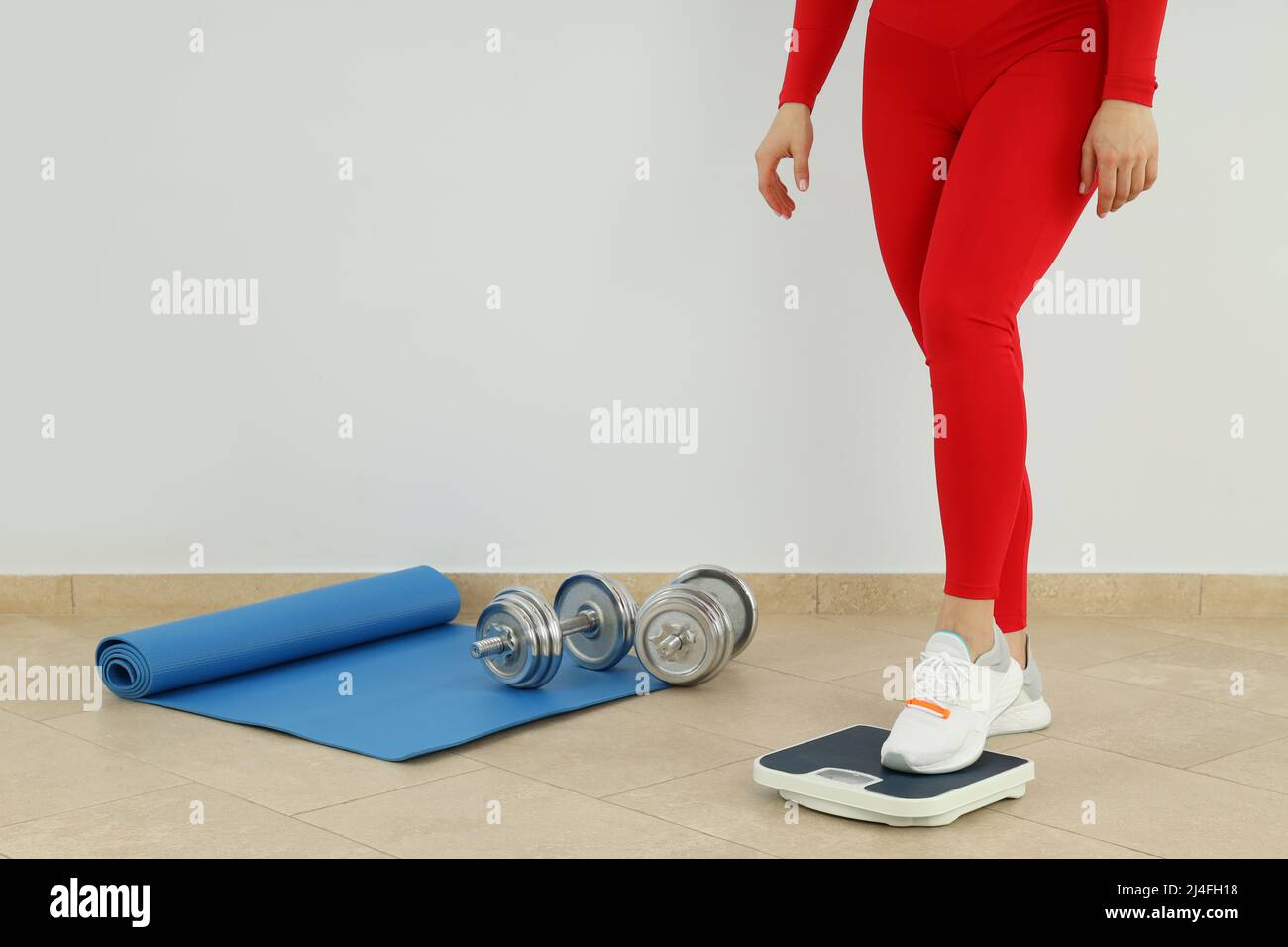 Concept of healthy lifestyle with woman get on the scales Stock Photo ...