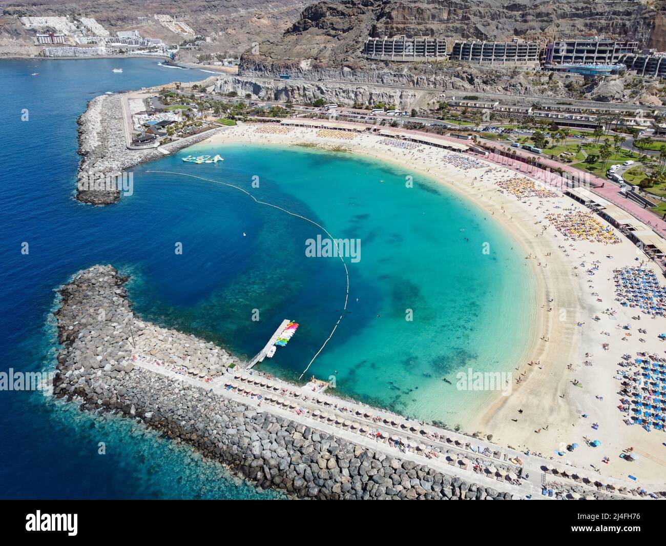 Aerial drone photo. Playa de Amadores, large cove with a white sand ...