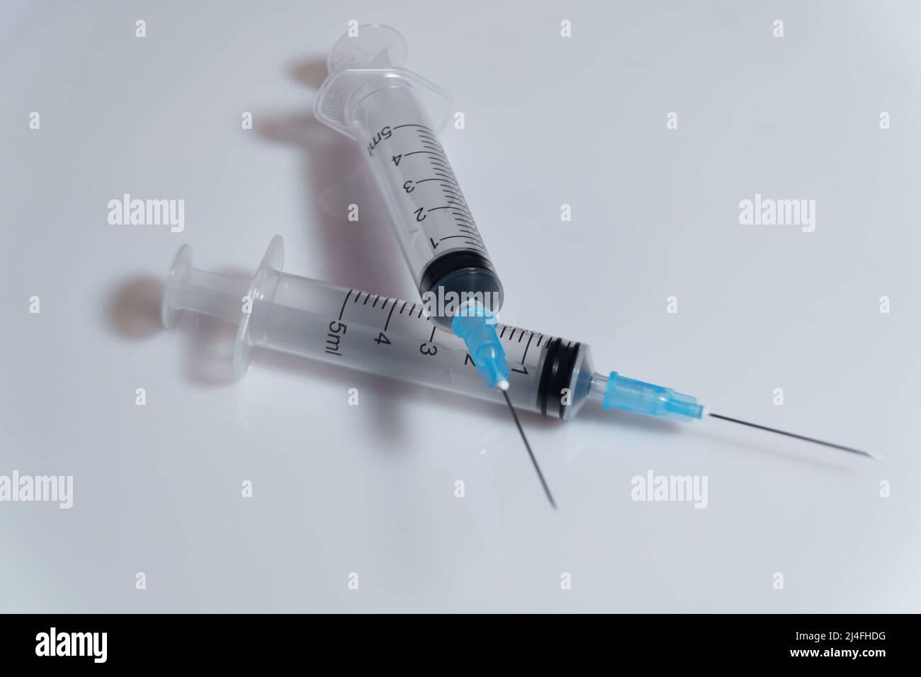 Medical syringe on a white background. A syringe for injection. concept ...