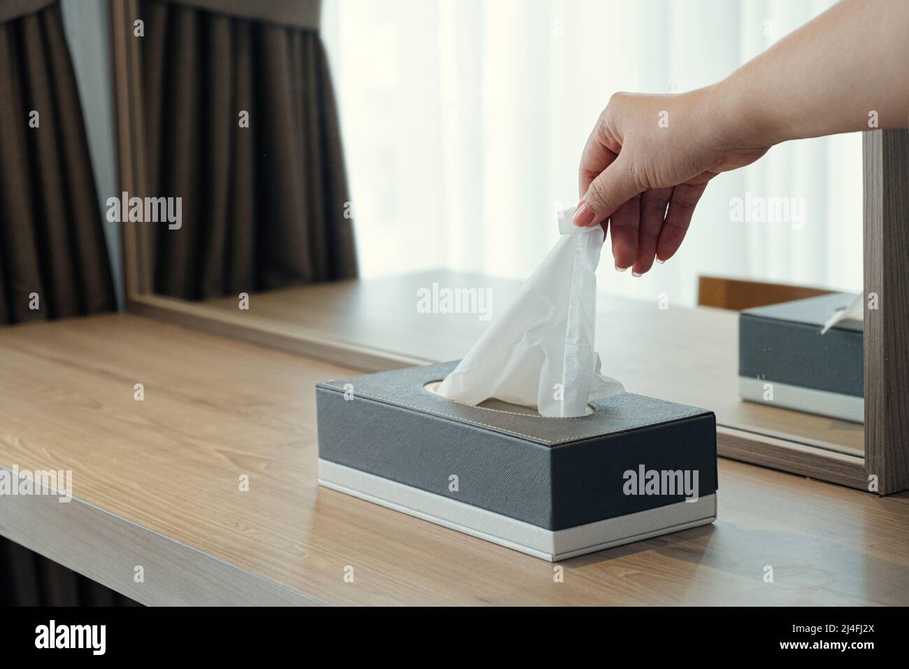 close up of woman hand is grab a tissue paper from the tissue box Stock ...
