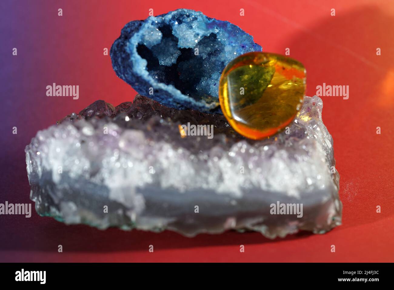 Quartz with mineral inclusions in the studio in front of a background ...