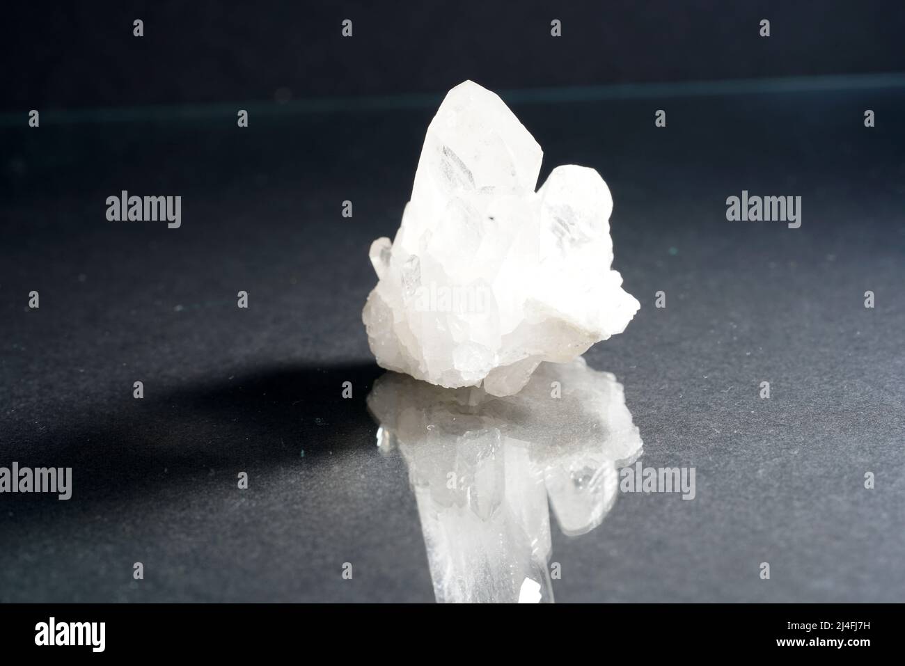 Quartz with mineral inclusions in the studio in front of a background ...