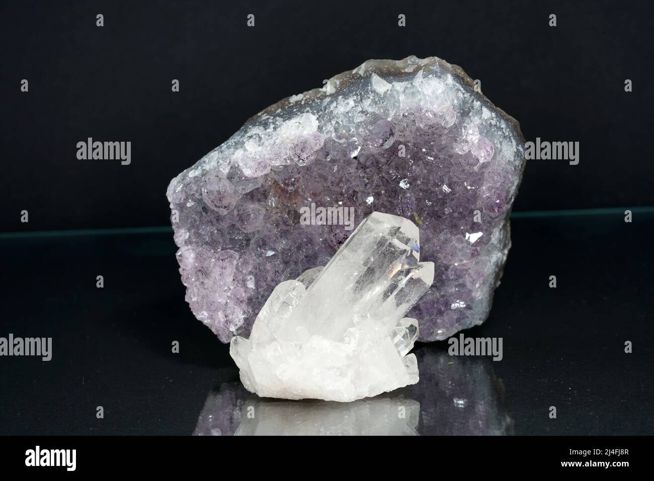 Quartz with mineral inclusions in the studio in front of a background ...