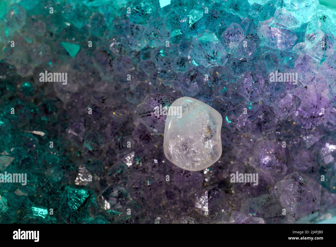 Quartz with mineral inclusions in the studio in front of a background ...
