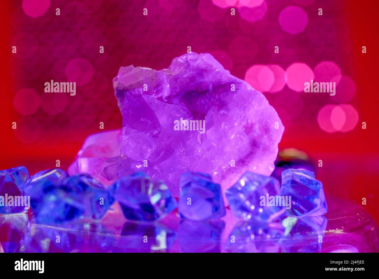 Quartz with mineral inclusions in the studio in front of a background ...